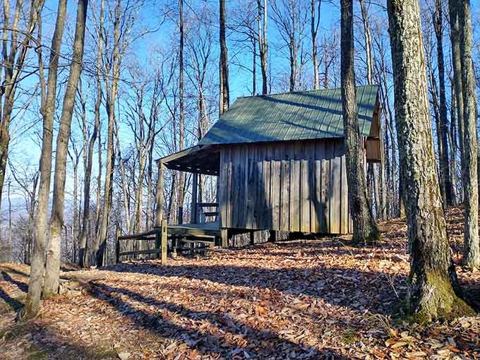 A rustic cabin nestled in the woods offers shelter and a reminder of simpler times in these mountains.
