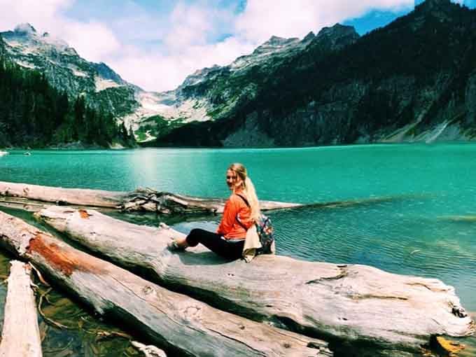Finding your perfect lakeside perch for lunch becomes the reward after hours of steady climbing.