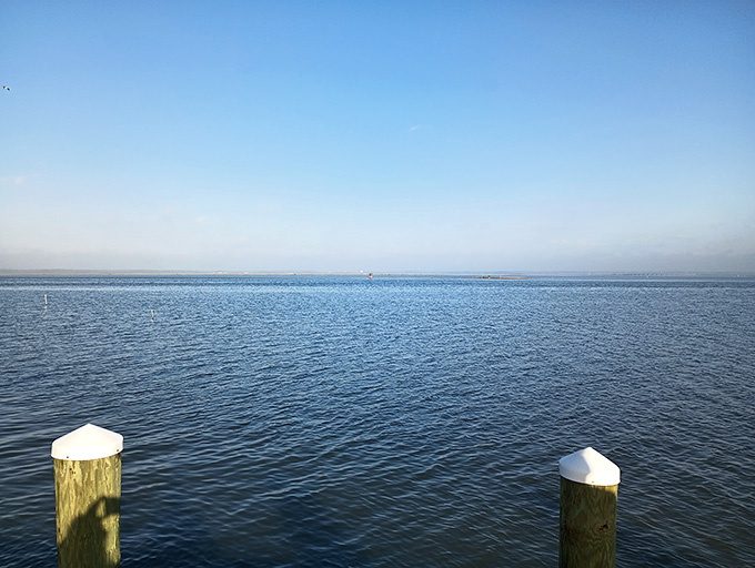 The calm bay waters stretch endlessly, reminding you why people have always been drawn to the sea.