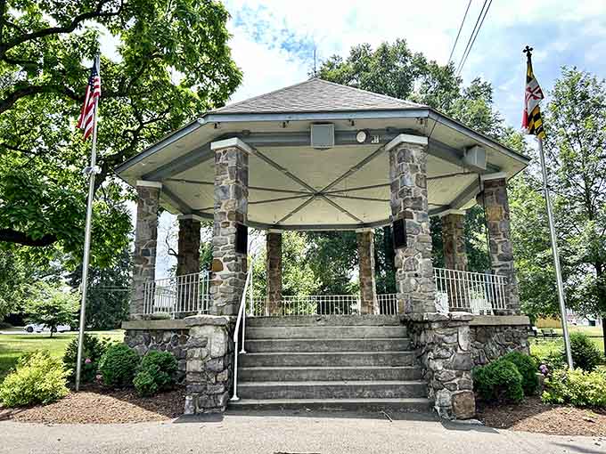 Stone pillars support this classic bandstand where summer concerts once filled warm evenings with music that brought entire neighborhoods together under the stars.
