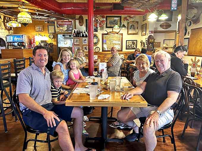 Three generations sharing a meal together, proving that great food creates the best family traditions and memories.
