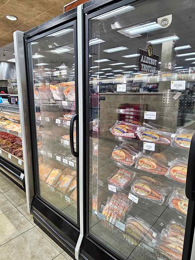 Frozen treats and prepared foods behind spotless glass, because even convenience store meals deserve proper presentation here.
