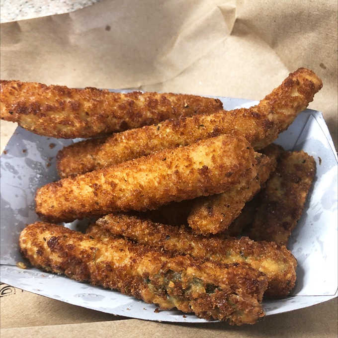 Crispy zucchini sticks with ranch dressing let you pretend you're eating vegetables while actually enjoying fried heaven.