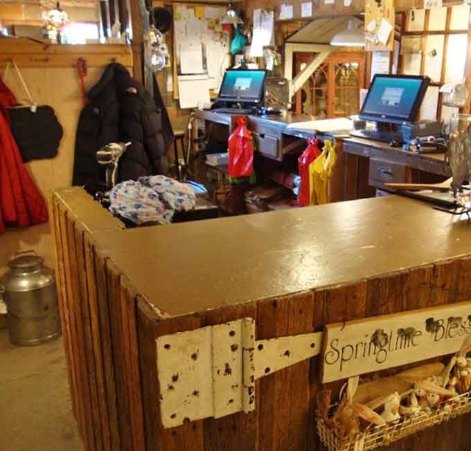 Modern checkout stations blend seamlessly with rustic barn architecture, proving old and new can coexist without losing authentic character.