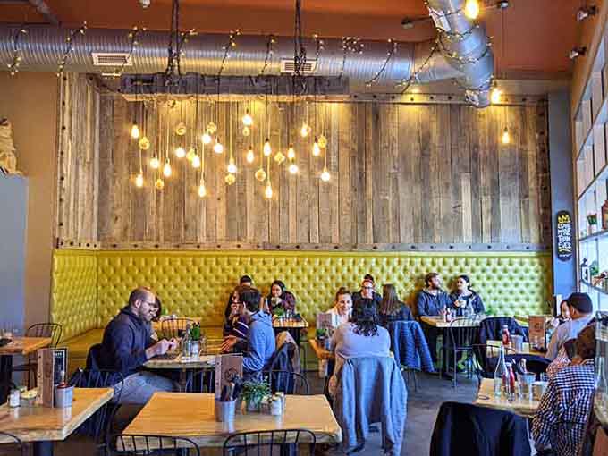 Real people enjoying real food in a real cafe &ndash; the kind of authentic dining scene that makes you want to join them.