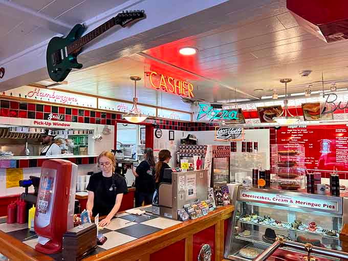 The counter area where magic happens, complete with neon signs and staff who understand their role in the time machine.