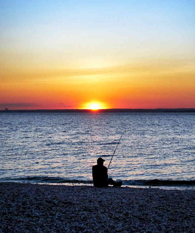 Sunset fishing at Caumsett beats any fancy restaurant reservation, and the entertainment is absolutely free.