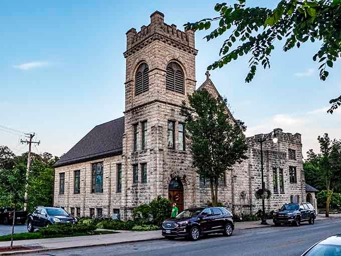 This limestone church tower reaches skyward with the kind of craftsmanship that makes modern construction look like it's phoning it in.