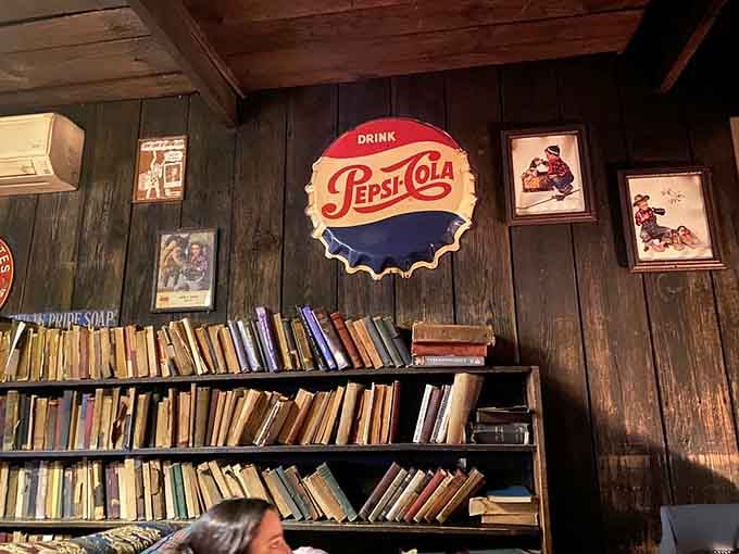 That giant Pepsi sign watches over shelves packed with books, blending Americana with literary charm beautifully.