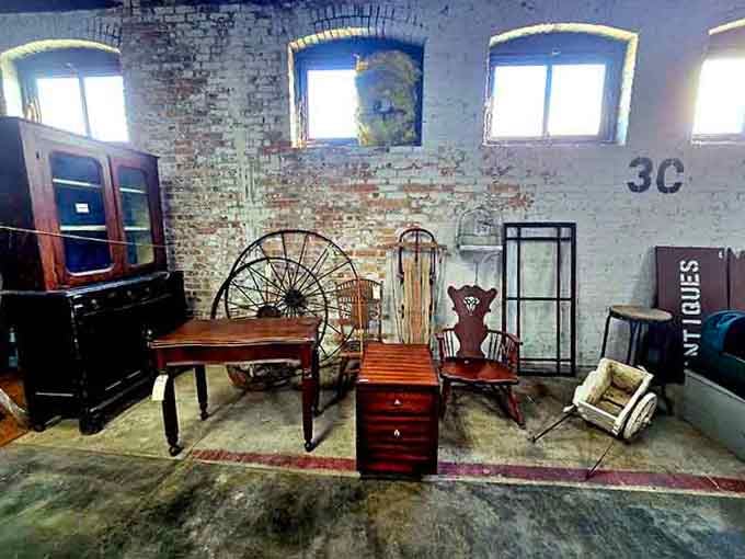 Exposed brick walls frame vintage furniture arrangements that make you reconsider your entire home decorating scheme.