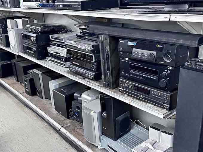 Stereo systems from various decades coexisting peacefully, like a technology museum where everything's actually for sale and affordable.
