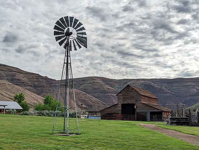 The old windmill stands as a reminder of ranch life, still turning in the desert breeze.