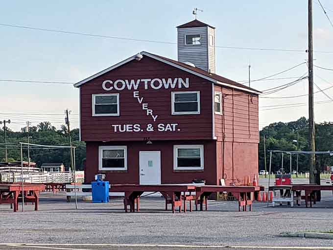 The red barn building announces market days like a beacon, because subtlety has no place in flea market advertising.
