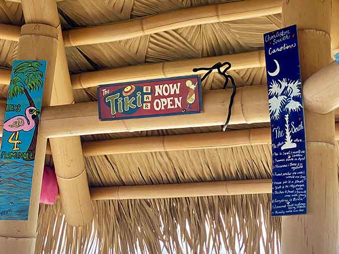 The "Tiki is NOW OPEN" sign says it all, promising tropical escapism without the hassle of airport security lines.