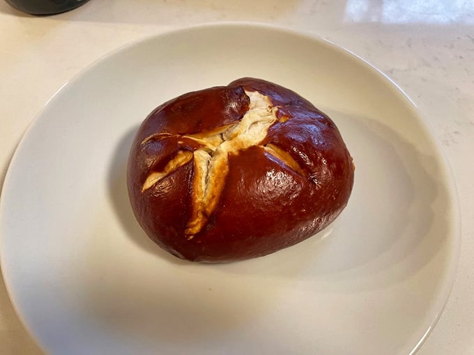 The pretzel bun proves that sometimes the best things in life are shiny, golden, and carb-loaded.