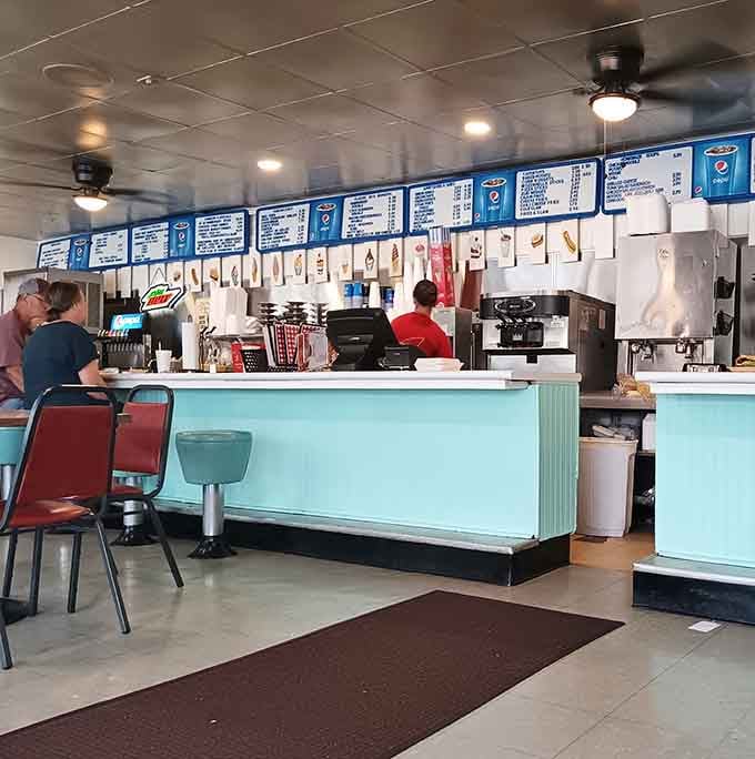 That turquoise counter has seen more orders, conversations, and satisfied customers than most restaurants see in a lifetime.