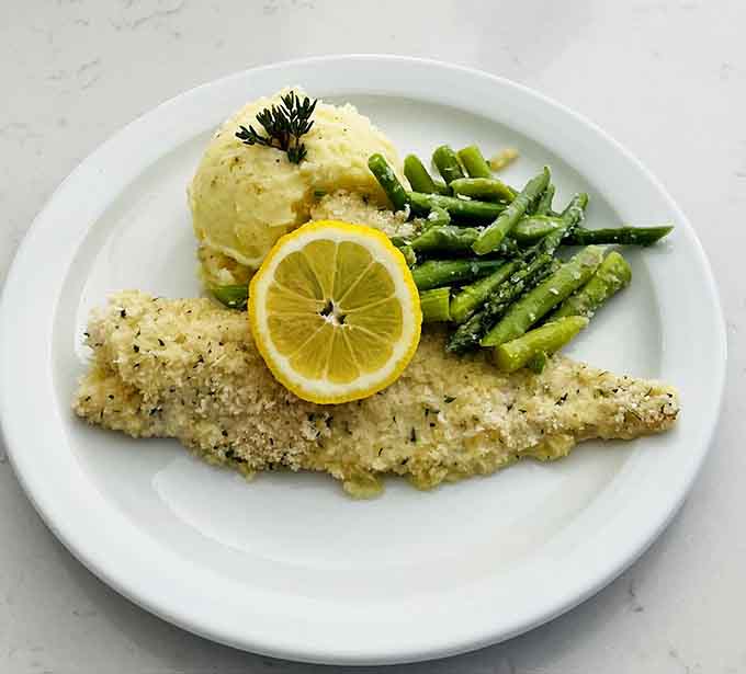 Lemon baked haddock with asparagus and mashed potatoes: proof that healthy eating doesn't mean sacrificing flavor.