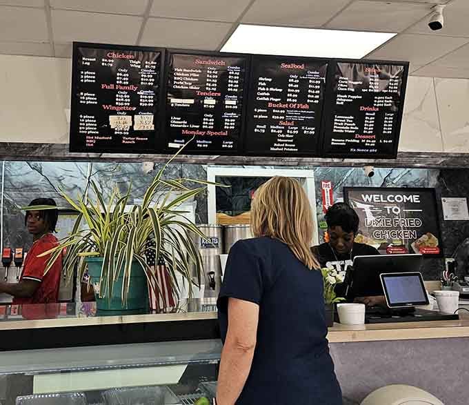 The order counter is where dreams of crispy chicken become reality, one perfectly prepared meal at a time for hungry customers.