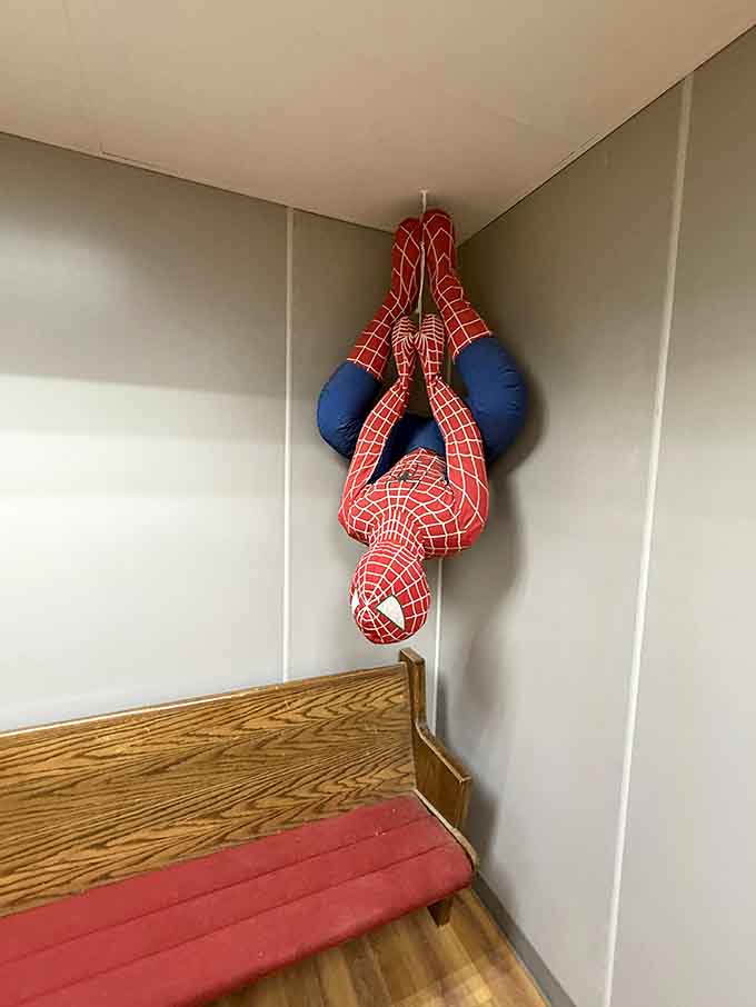 Spider-Man hanging upside down in the corner, because even superheroes need a place to rest between saving the world.