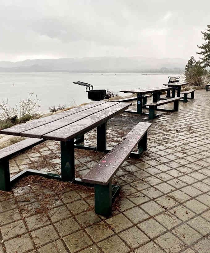 Picnic tables wait patiently for visitors, offering front-row seats to the greatest show on earth.