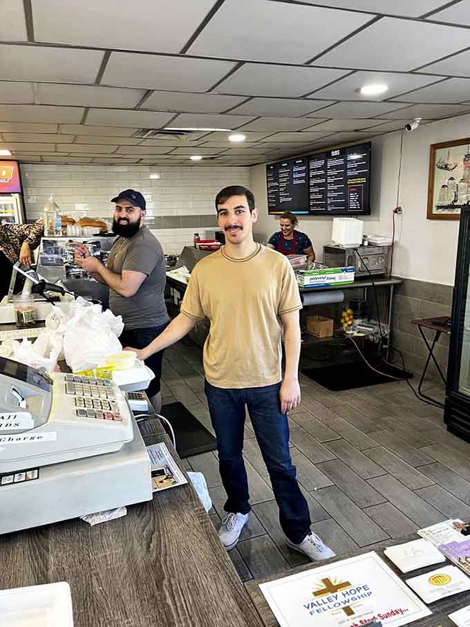The friendly faces behind the counter, ready to craft your sandwich with skill and genuine care.