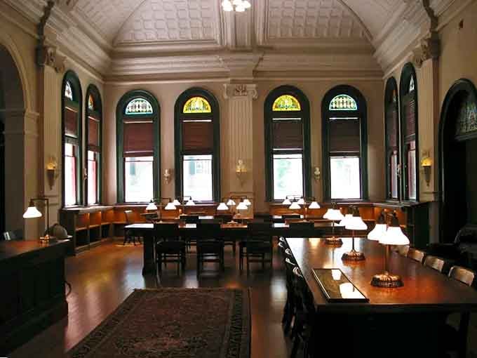 Arched windows bathe reading tables in natural light, creating the perfect atmosphere for losing yourself in research.