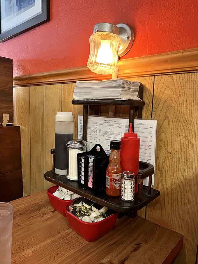 Classic diner condiments station: where hot sauce meets ketchup and breakfast magic happens every morning.