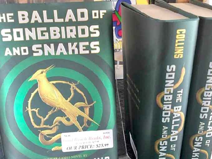 Suzanne Collins' dystopian masterpiece sits proudly on display, ready for new readers to discover Katniss's journey.