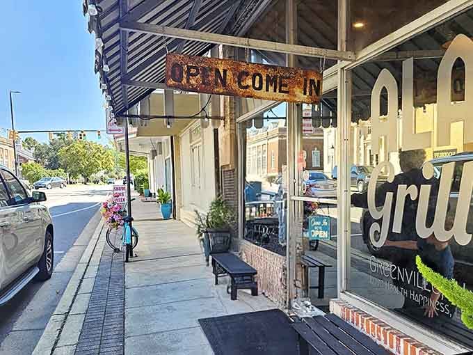Alabama Grill welcomes you in with a rusty sign that's got more charm than a dozen fancy neon displays.