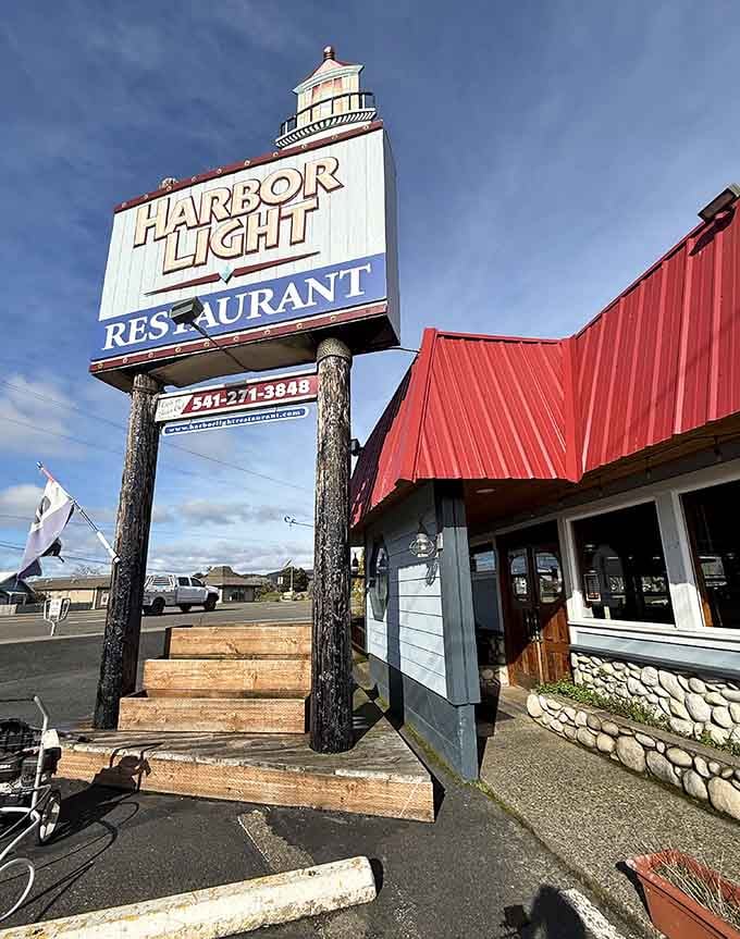 The classic roadside sign stands proud, announcing Harbor Light to Highway 101 travelers who know good food awaits.