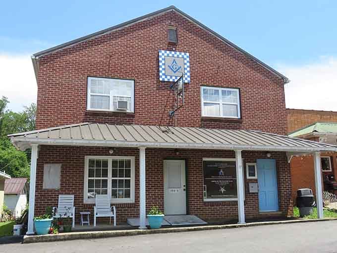 The Masonic Lodge's quilt square decoration celebrates Appalachian craft traditions with colorful mountain pride.