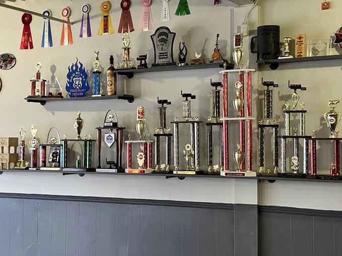 Shelves lined with trophies and ribbons, the kind of hardware collection that speaks louder than any advertisement ever could.