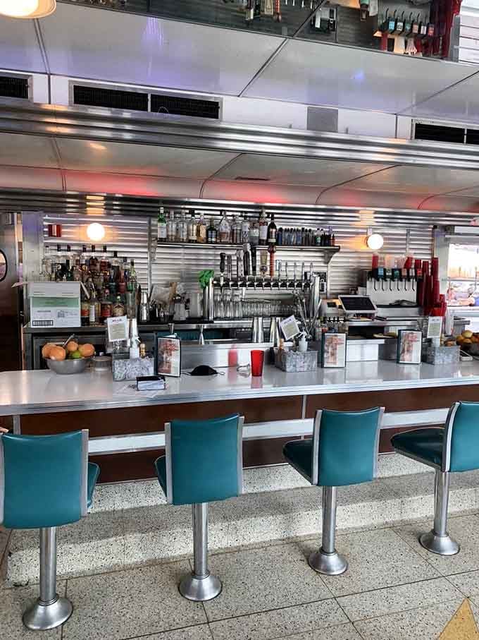 The bar area gleams like a vintage car show, complete with enough chrome to blind you on sunny days.