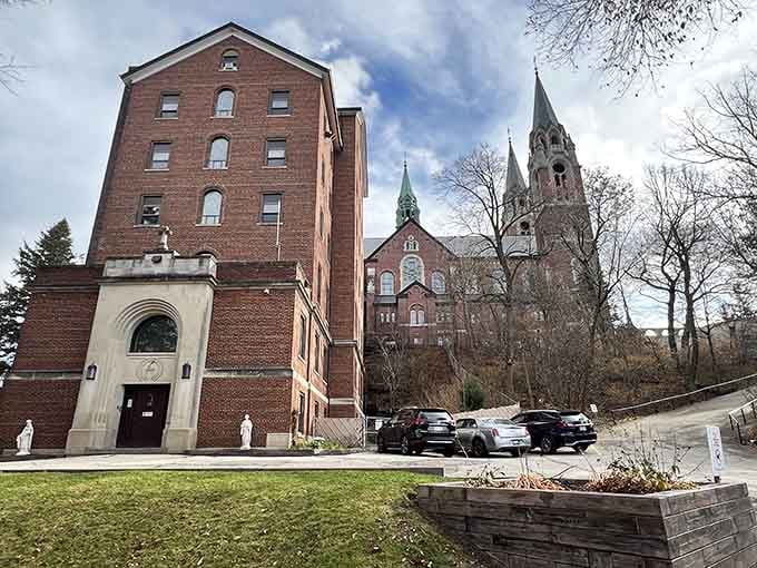 The monastery buildings and parking area welcome visitors year-round, making this spiritual destination accessible to all seekers.
