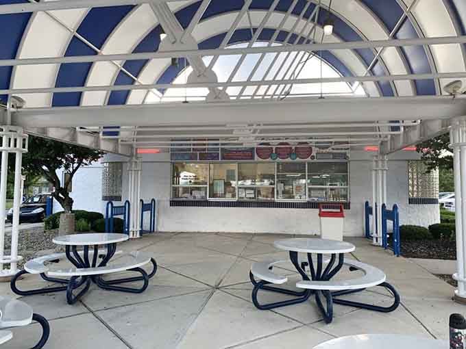 The outdoor seating under that classic canopy turns every visit into a scene from your favorite vintage movie.