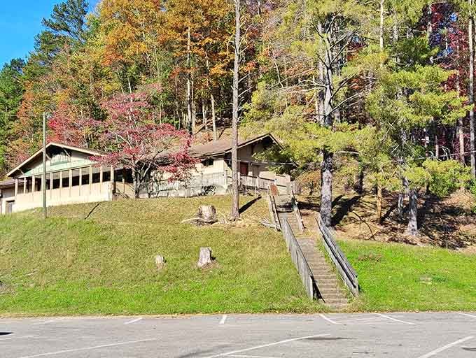 The clubhouse perched on the hillside like it grew there naturally among the autumn colors.