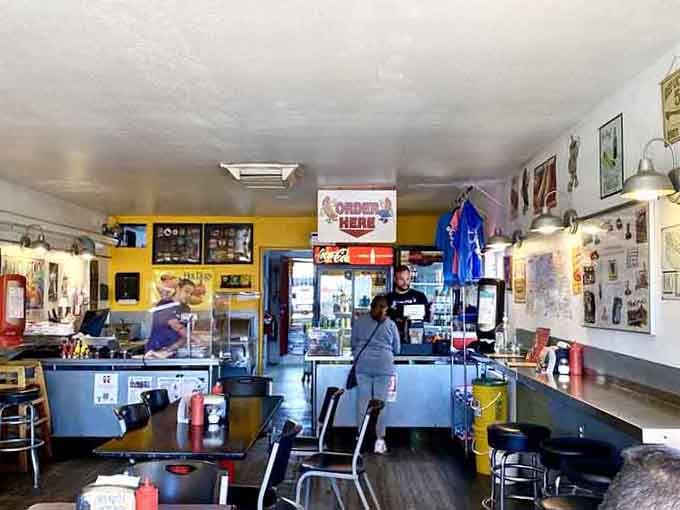 The counter stretches invitingly beneath walls plastered with Americana, where ordering feels like visiting an old friend's kitchen.