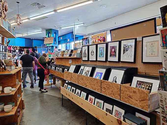 Local artists' work fills the gallery space, transforming shopping into an impromptu museum visit with a cash register.
