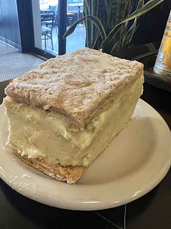 This towering slice of cream-filled heaven makes you understand why dessert has its own separate stomach compartment.