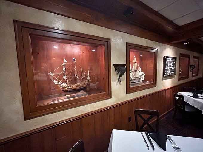 Model ships in display cases add nautical charm, because every great steakhouse needs a little unexpected character.