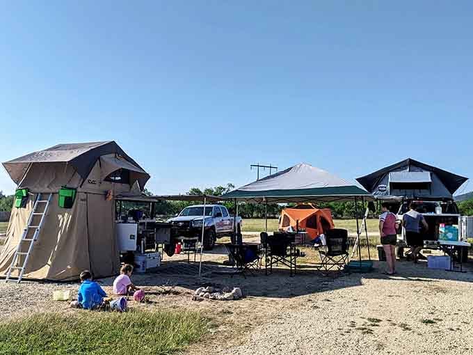 Rooftop tents and canopies create a camping village, where neighbors become friends over shared river stories.