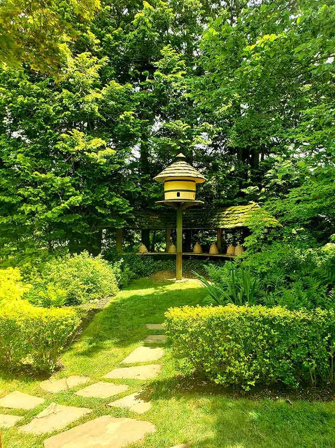 Even the birdhouse gets the royal treatment here, perched among golden foliage like avian luxury real estate.
