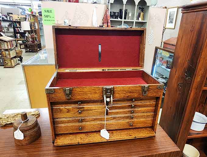 A craftsman's toolbox with red velvet lining, because even hammers and screwdrivers deserved luxury accommodations back then.