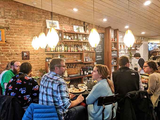 Cozy tables filled with happy diners prove good food creates the best kind of neighborhood gathering.