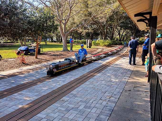 The covered platform keeps passengers comfortable while they wait for their locomotive to arrive, right on schedule naturally.