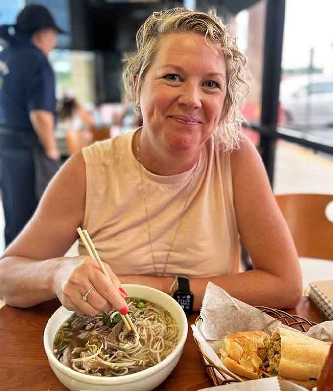 The smile says it all: this is someone who just discovered their new favorite restaurant on Buford Highway.