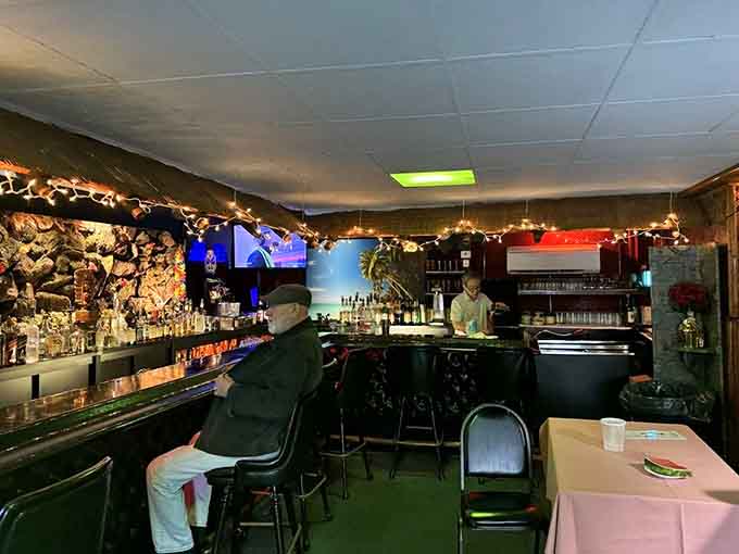 The bar area looks like Don the Beachcomber's fever dream, complete with enough tiki decor to satisfy any mid-century enthusiast.