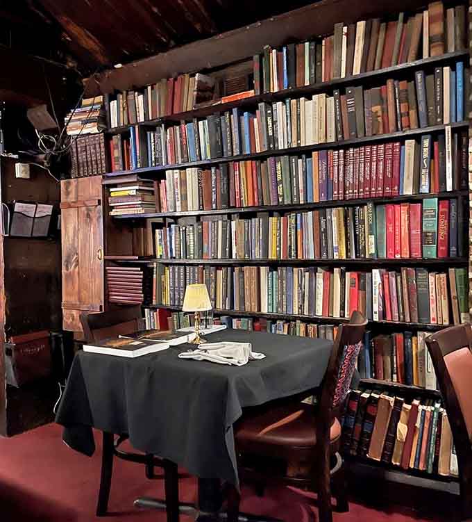 Actual books on actual shelves create intimate dining nooks where your steak dinner comes with a side of literary ambiance.