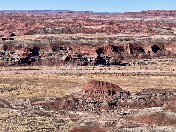 The textured landscape resembles crumpled paper smoothed out by time, wind, and the patient hand of erosion itself.