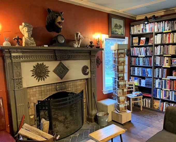 A fireplace surrounded by books creates the exact setting where mystery novels practically read themselves to you.